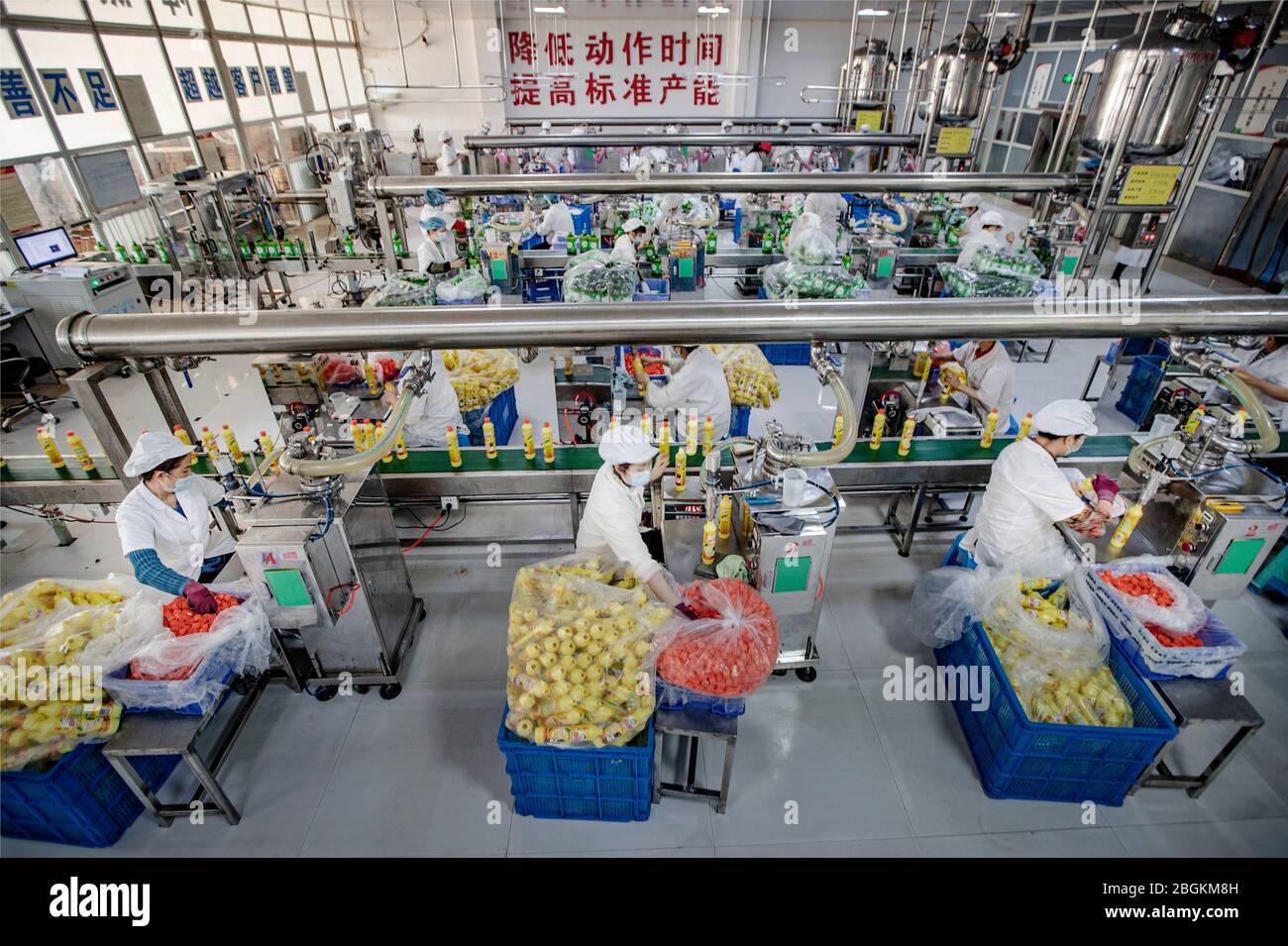 Production bottles workers hi-res stock photography and images - Alamy