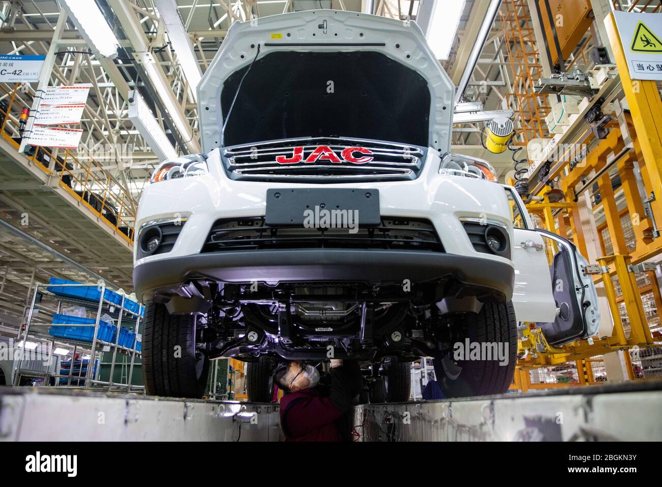 Staff are busy at assembling vehicles at a workshop of factory owned by ...