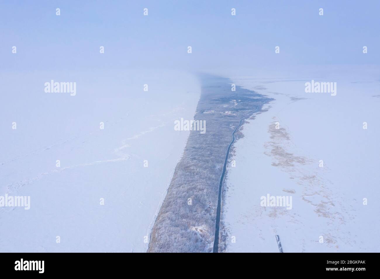 An aerial winter scenery of trees covered with rime around Xingkai Lake ...