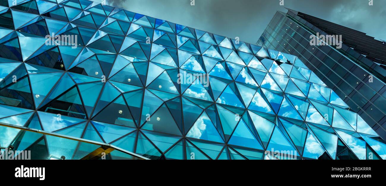 Glass architectural building exterior from low street angle Stock Photo ...