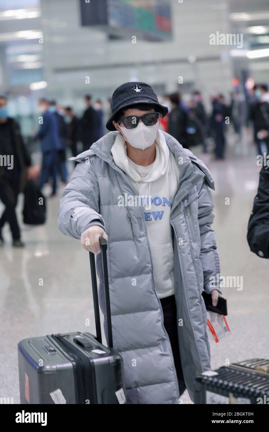 Chinese singer Charlie Zhou Shen arrives at a Shanghai airport after ...