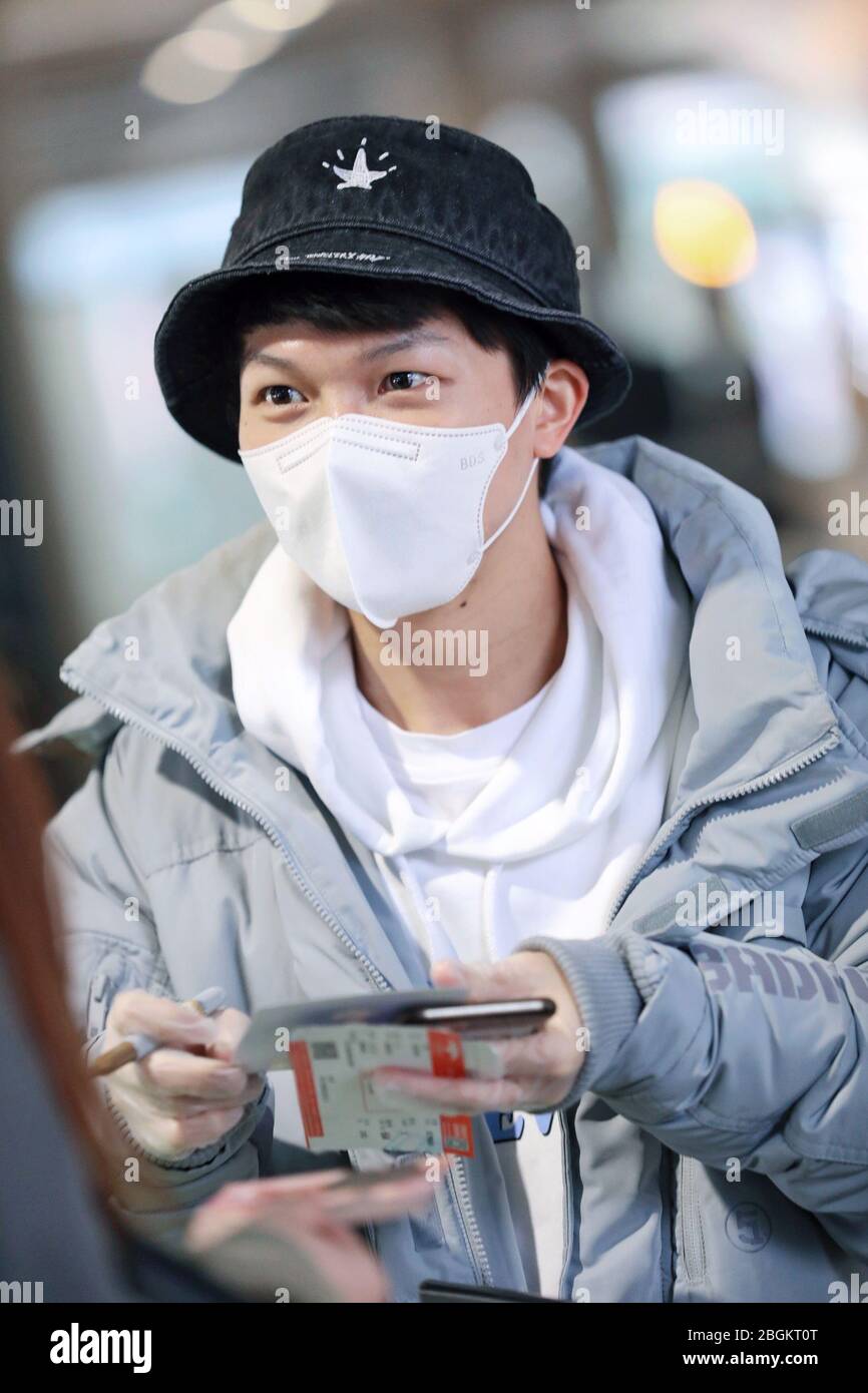 Chinese singer Charlie Zhou Shen arrives at a Shanghai airport after ...