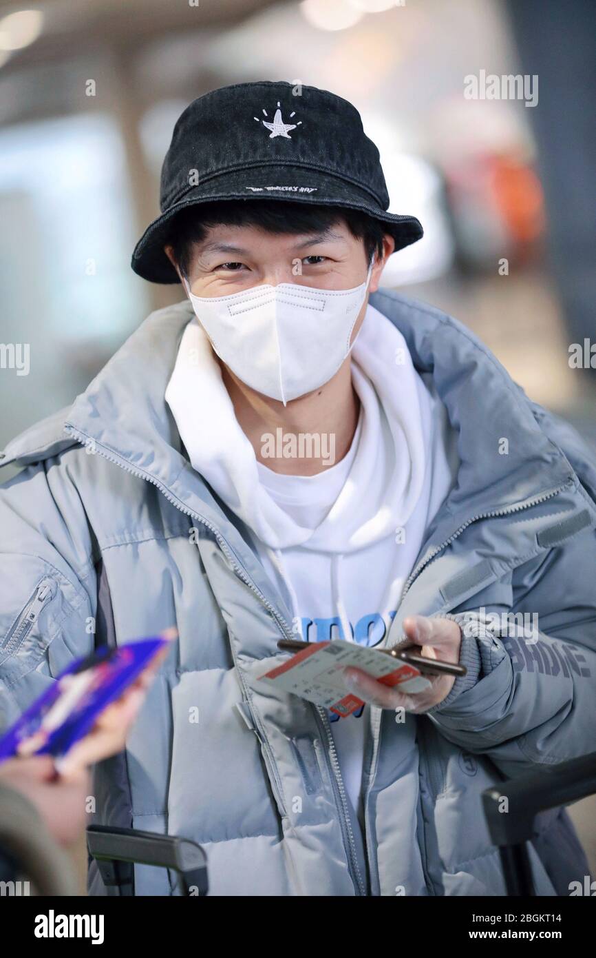 Chinese singer Charlie Zhou Shen arrives at a Shanghai airport after ...