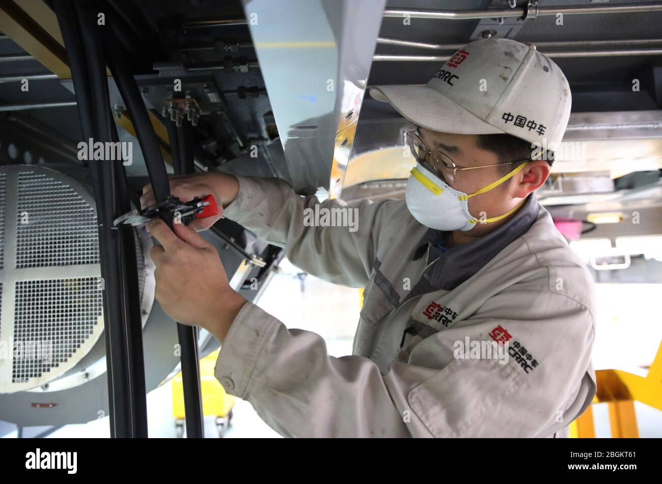 Staff of Chinese rolling stock manufacturer CRRC Qingdao Sifang work to ...