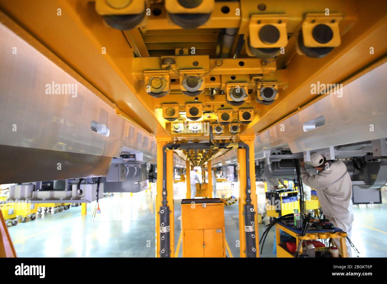 Staff of Chinese rolling stock manufacturer CRRC Qingdao Sifang work to ...
