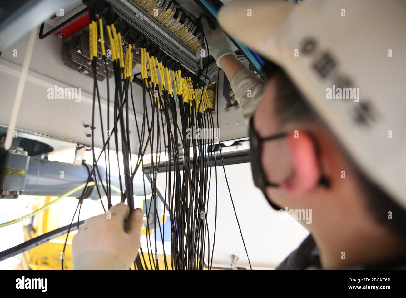 Staff of Chinese rolling stock manufacturer CRRC Qingdao Sifang work to ...
