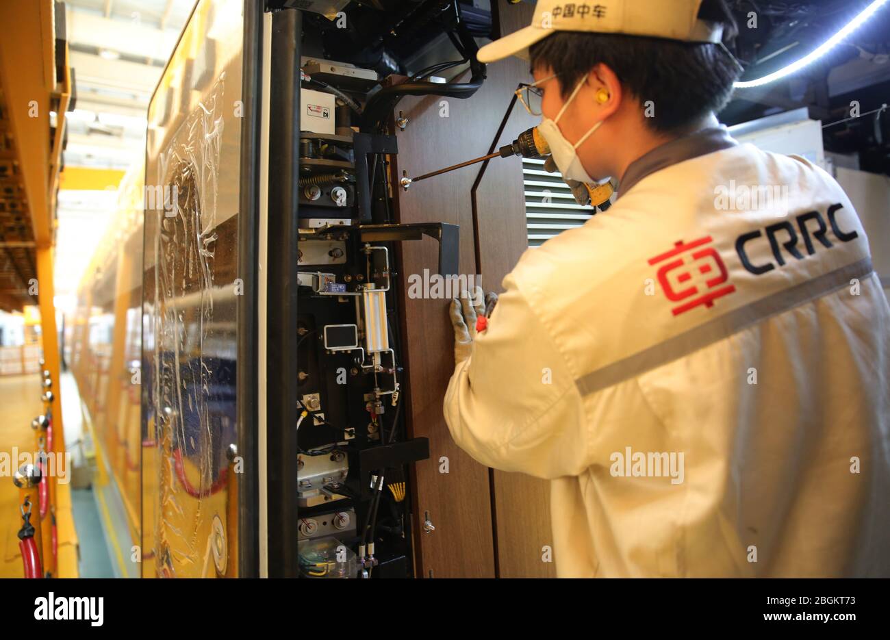 Staff of Chinese rolling stock manufacturer CRRC Qingdao Sifang work to ...