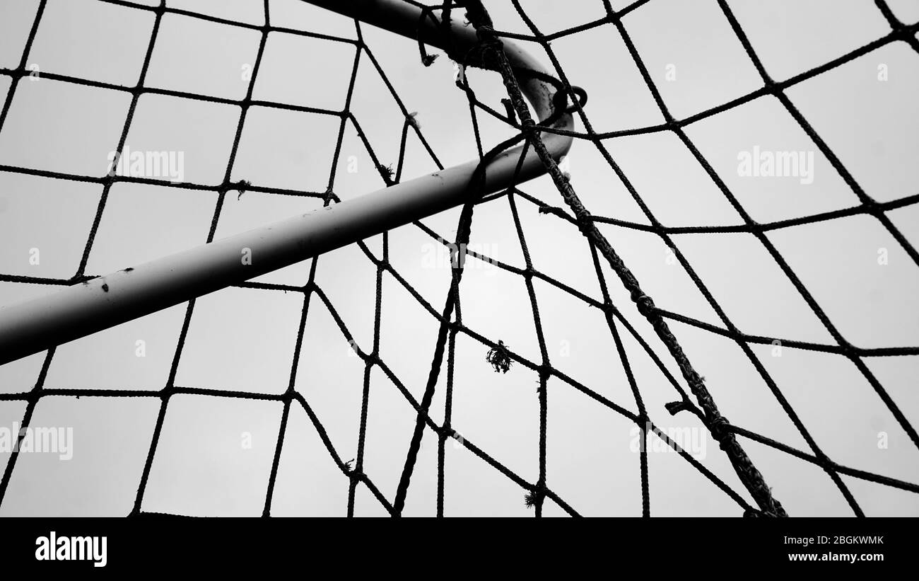 Torn net hole in net hi-res stock photography and images - Alamy