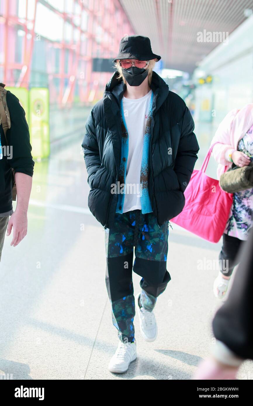 Chinese singer, dancer and rapper Huang Minghao arrives at a Beijing ...