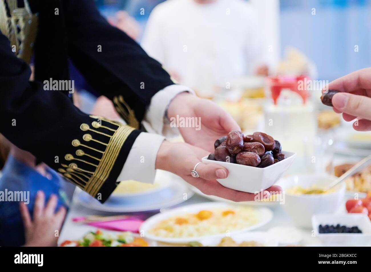 Eid Mubarak Muslim family having Iftar dinner eating dates to break ...