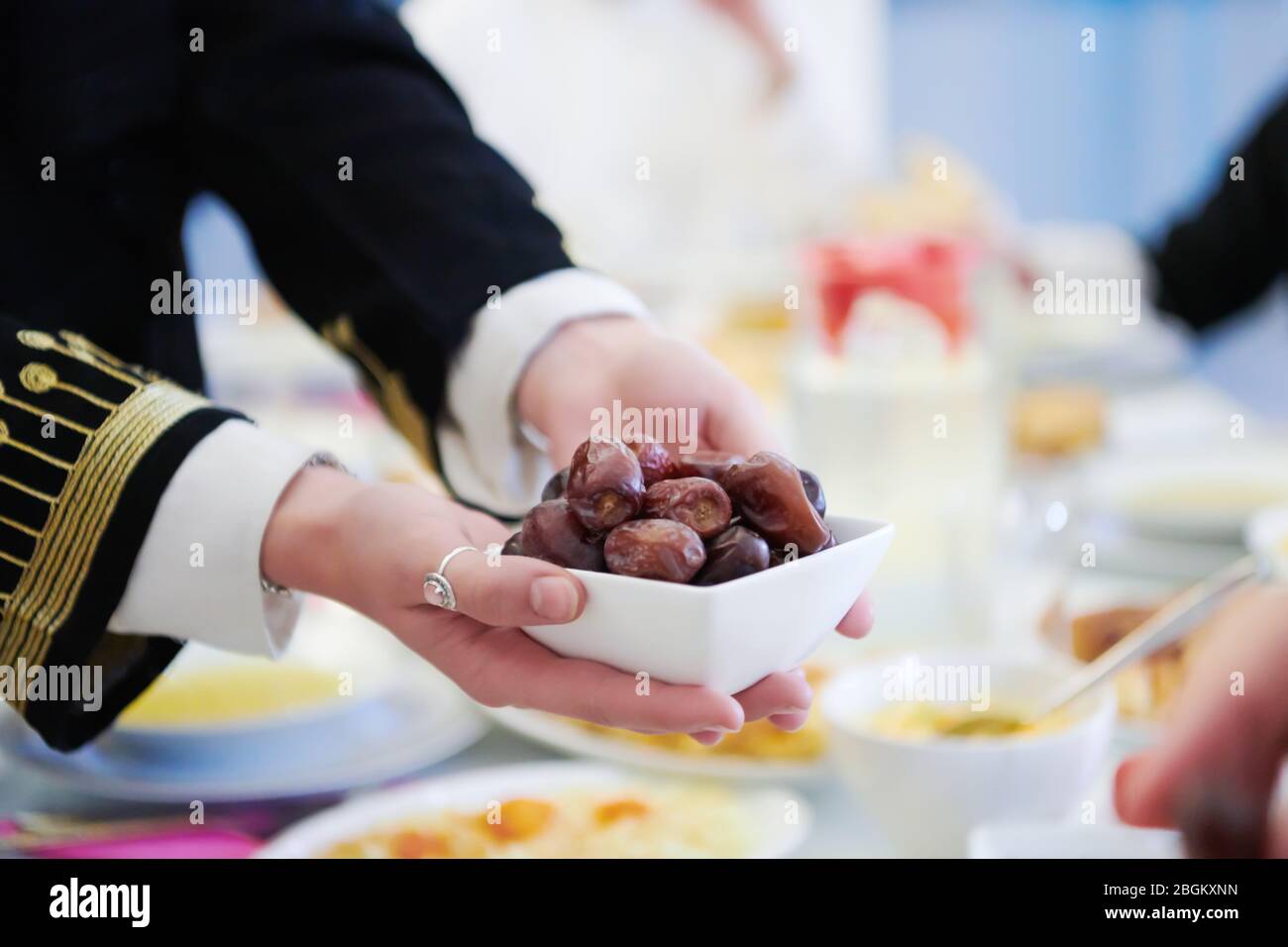 Eid Mubarak Muslim family having Iftar dinner eating dates to break ...