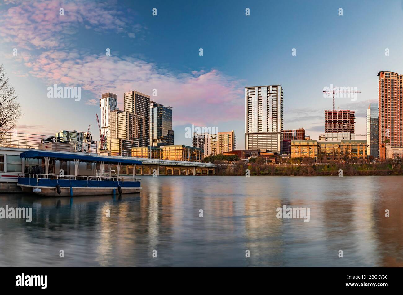 Downtown high-rises reflecting sunset golden hour light viewed across ...