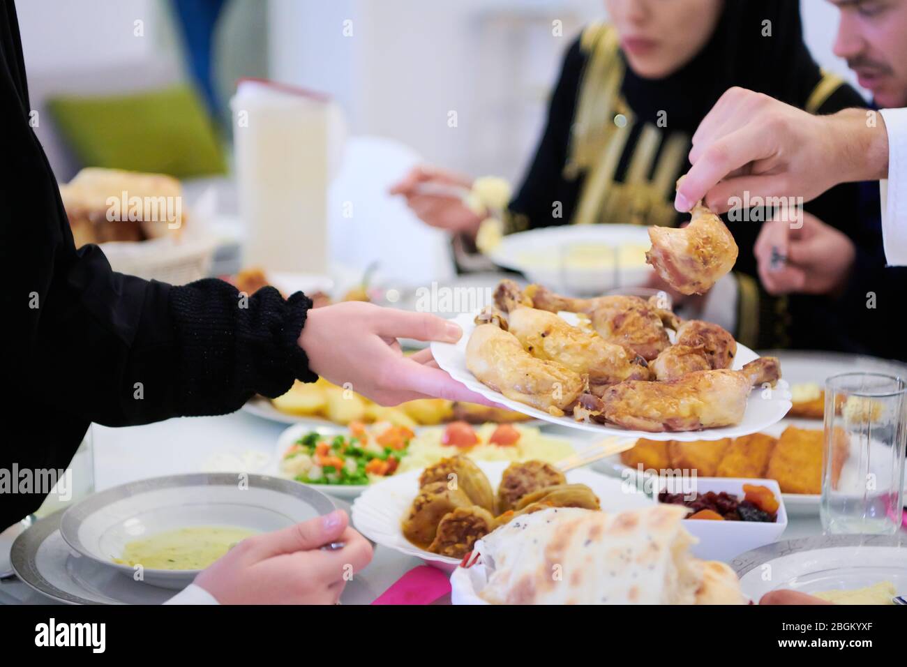 Eid Mubarak Muslim family having Iftar dinner Eating traditional food ...