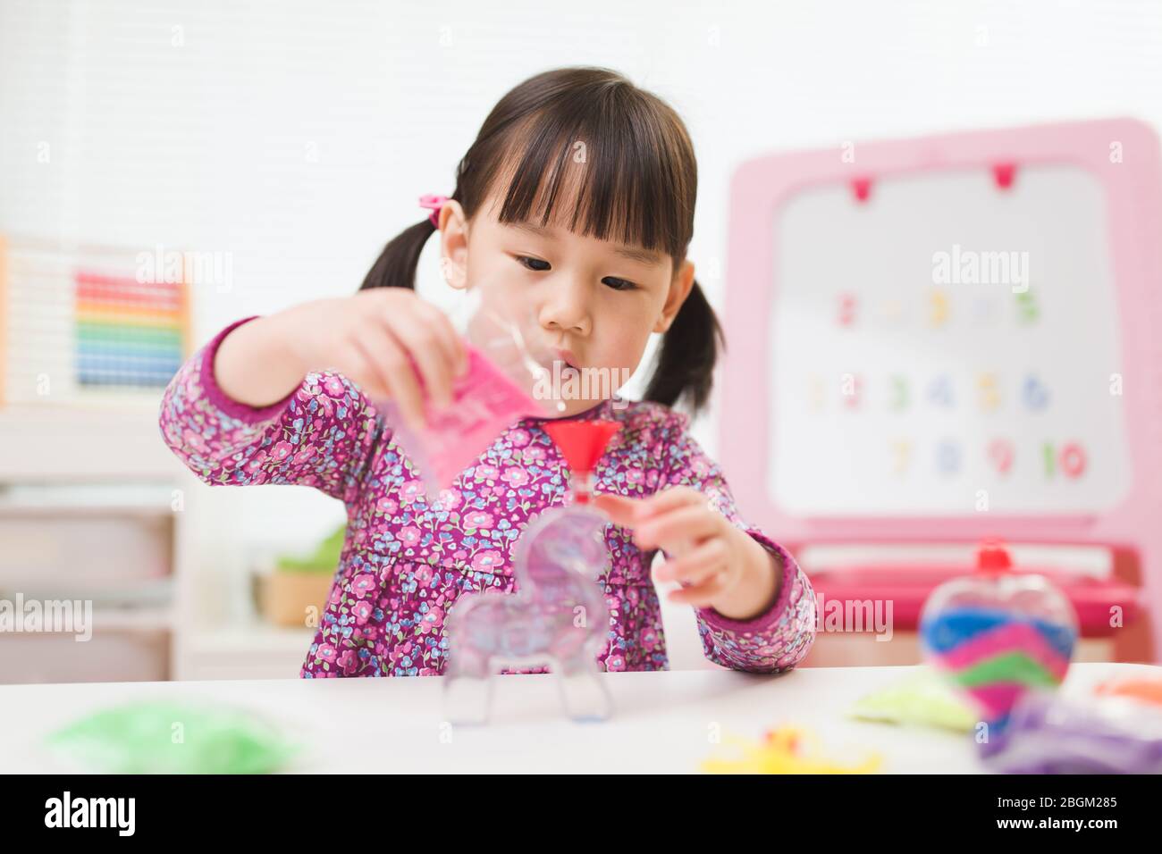 toddler girl making sand animal crafts for homeschooling Stock Photo ...