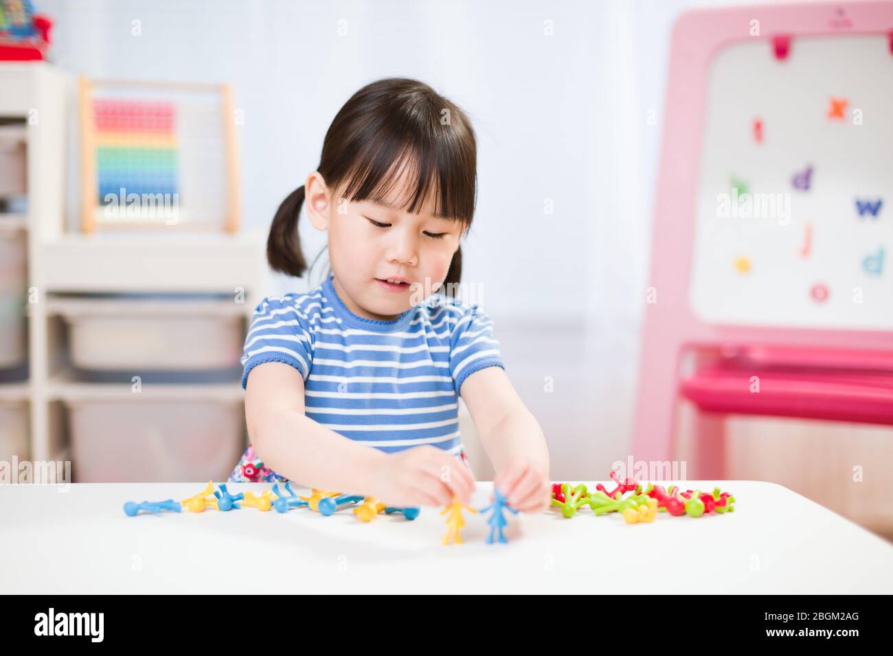 toddler girl learning counting and math for homeschooling Stock Photo ...