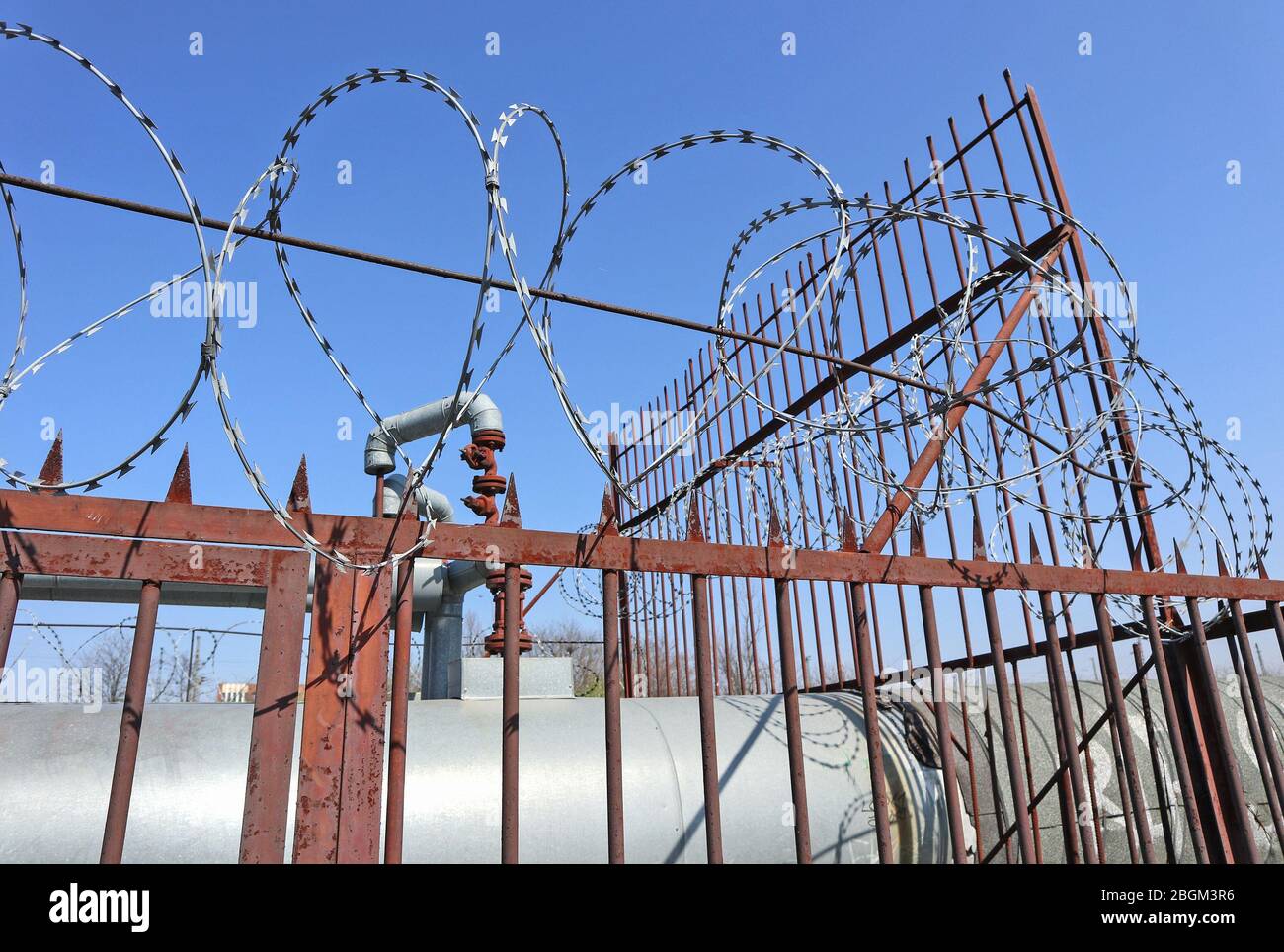 Barbed wire fence around the gas pipeline Stock Photo - Alamy