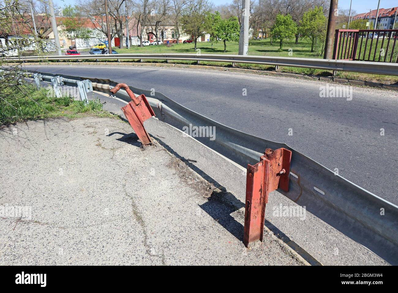 Damaged guard rail next to the road Stock Photo - Alamy