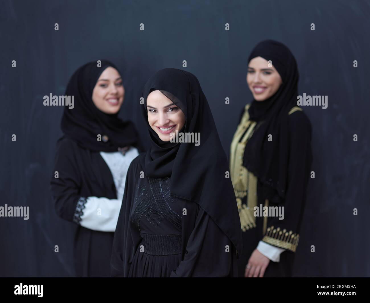 group portrait of beautiful muslim women in fashionable dress with ...