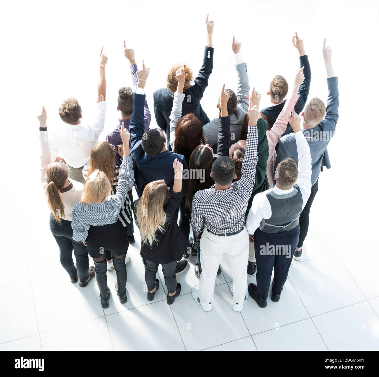 image of a group of diverse young people pointing in one direction ...