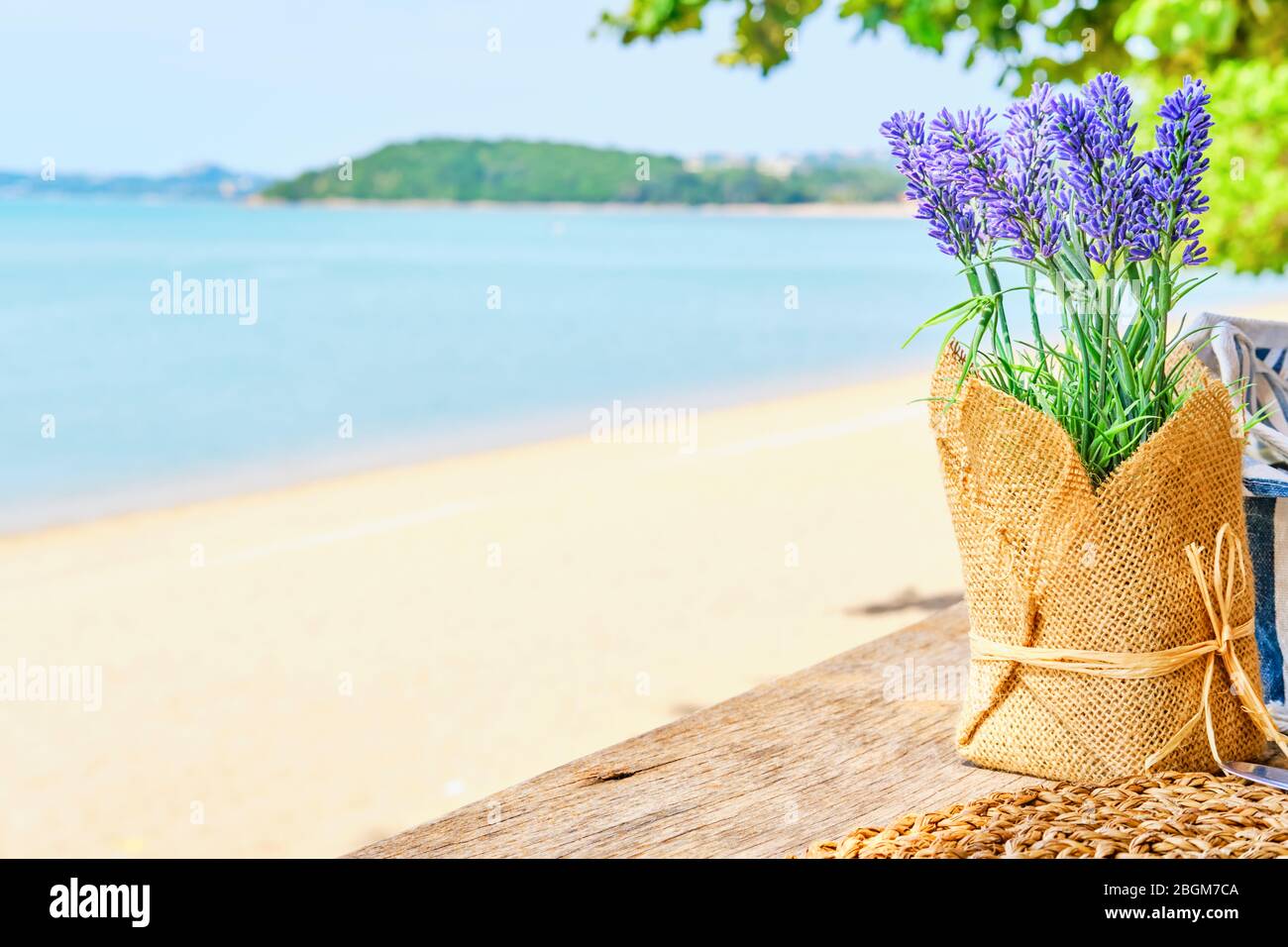 Lavender decoration table accent at the beach bar with sea background ...