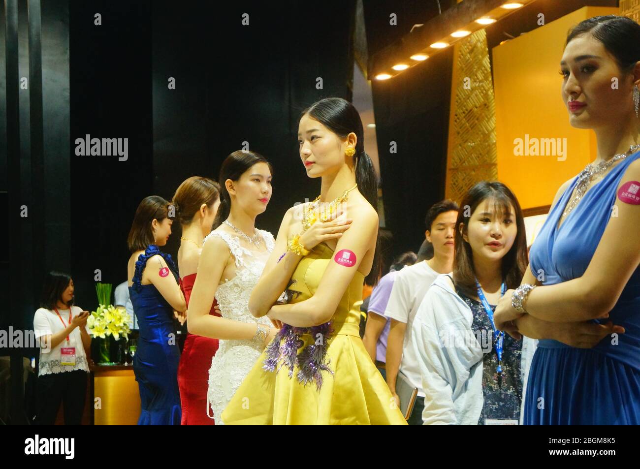 Female models display new gold jewelry Stock Photo - Alamy