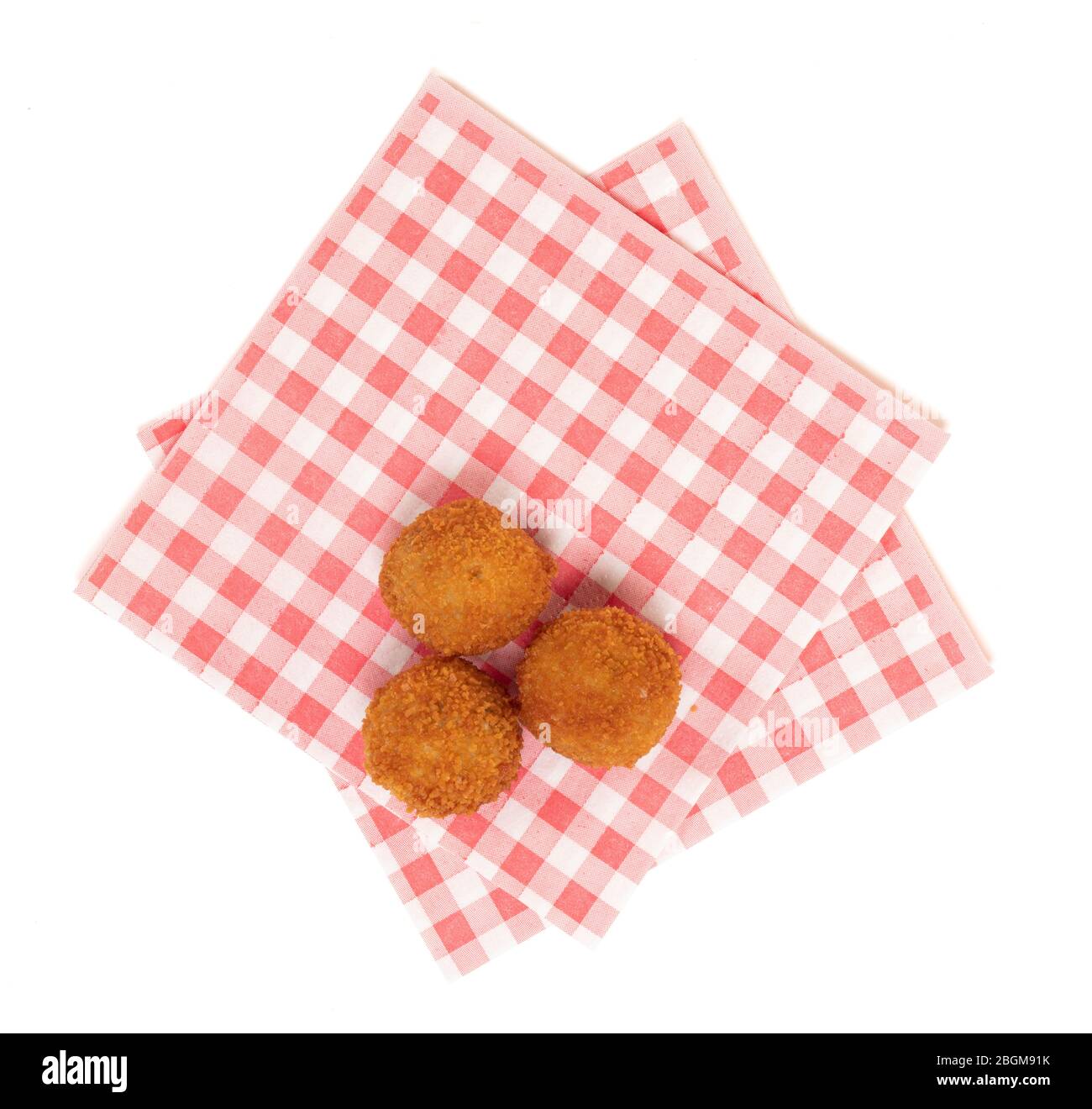 Dutch traditional snack bitterbal on a red and white napkin, isolated ...