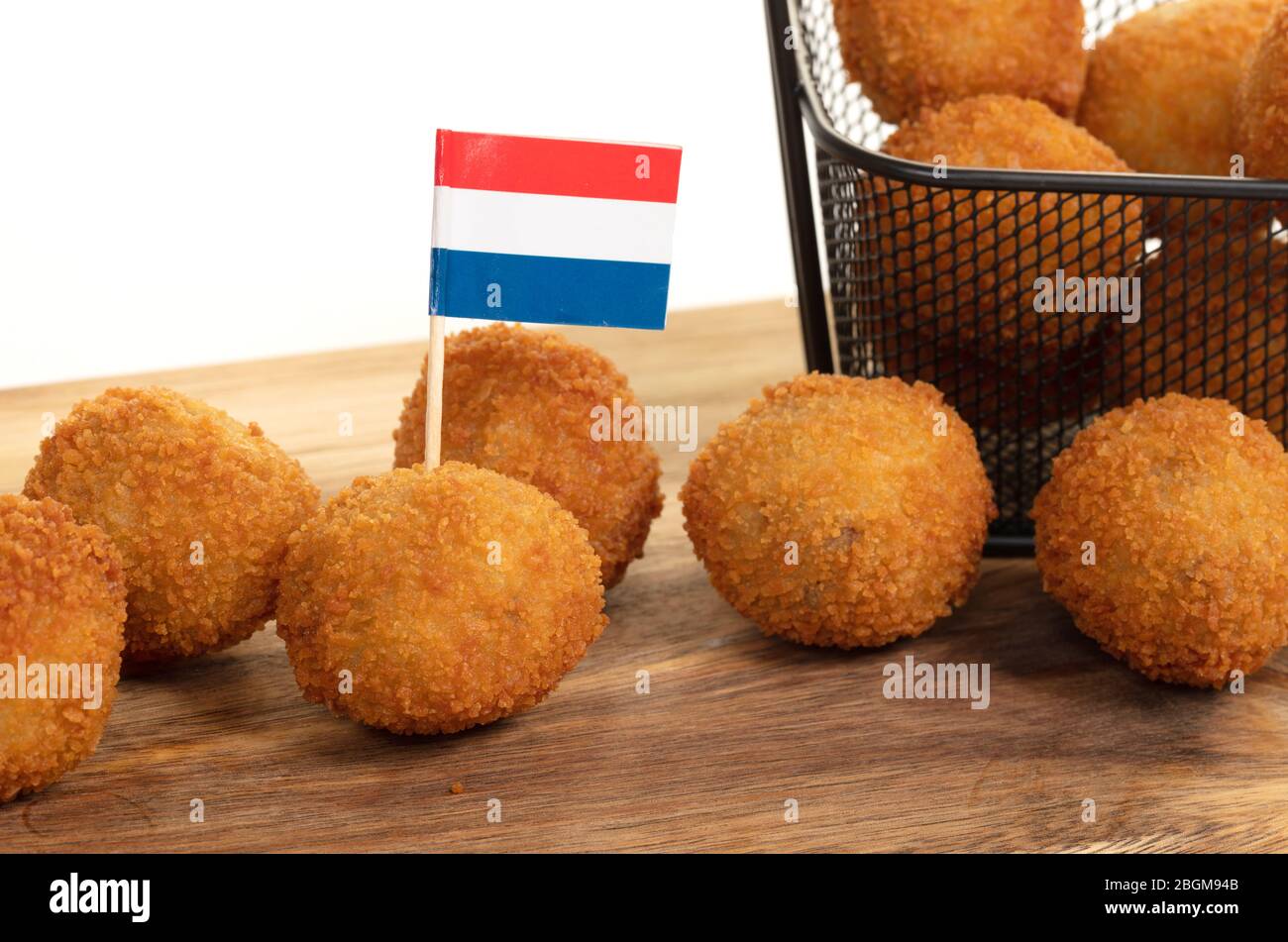 Dutch traditional snack bitterbal on a serving board, dutch flag ...