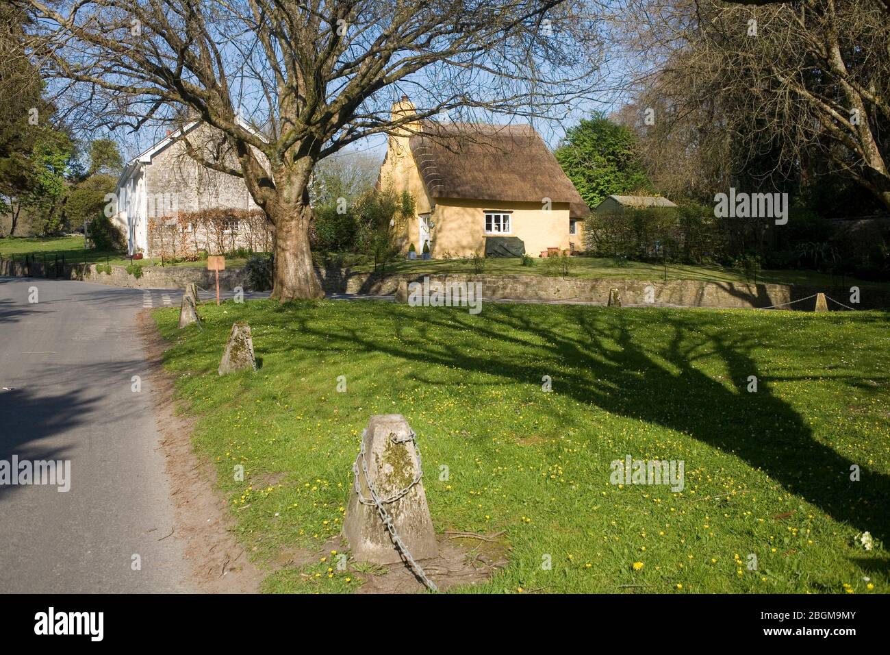 green at the centre of the village of Merthyr Mawr with thatched and ...