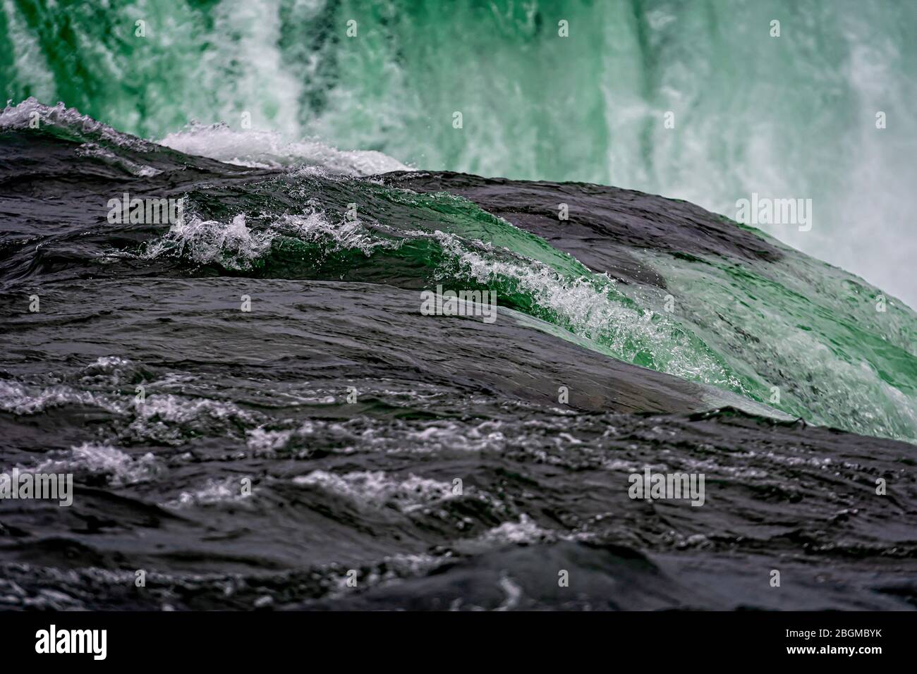 Niagara Falls splash close-up on a sunny day, lowing water background ...