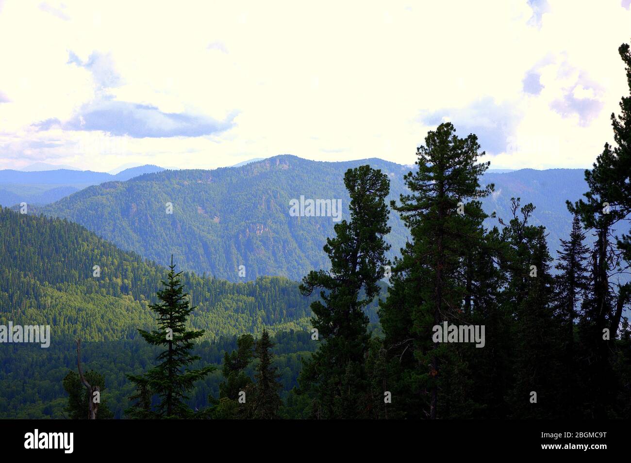 View from the top of the mountain to the mountain ranges through the ...