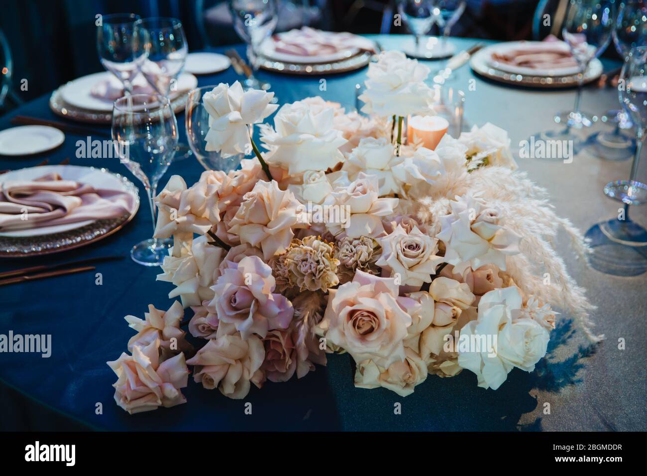 Elegant banquet table setting with flowers and candles Stock Photo - Alamy