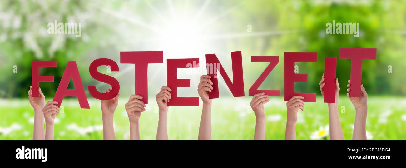 People Hands Holding Word Fastenzeit Means Fasting, Grass Meadow Stock ...