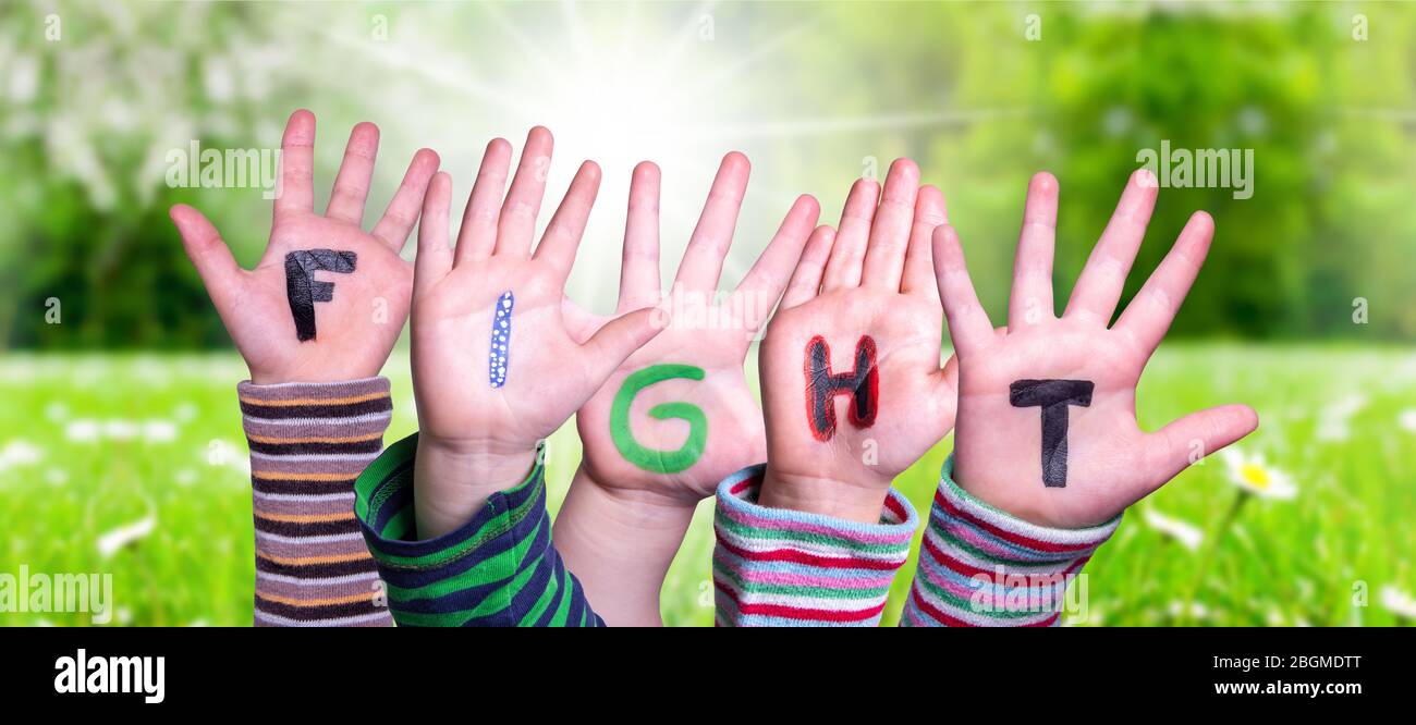 Children Hands Building Word Fight, Grass Meadow Stock Photo - Alamy