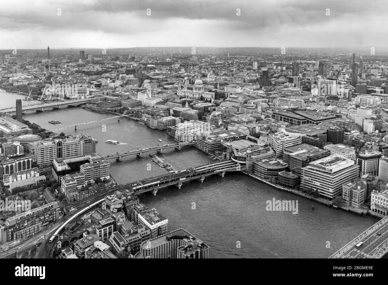 Aerial view over the City of London and River Thames in black and white ...