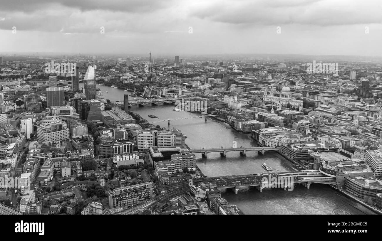 Aerial view over the City of London and River Thames in black and white ...