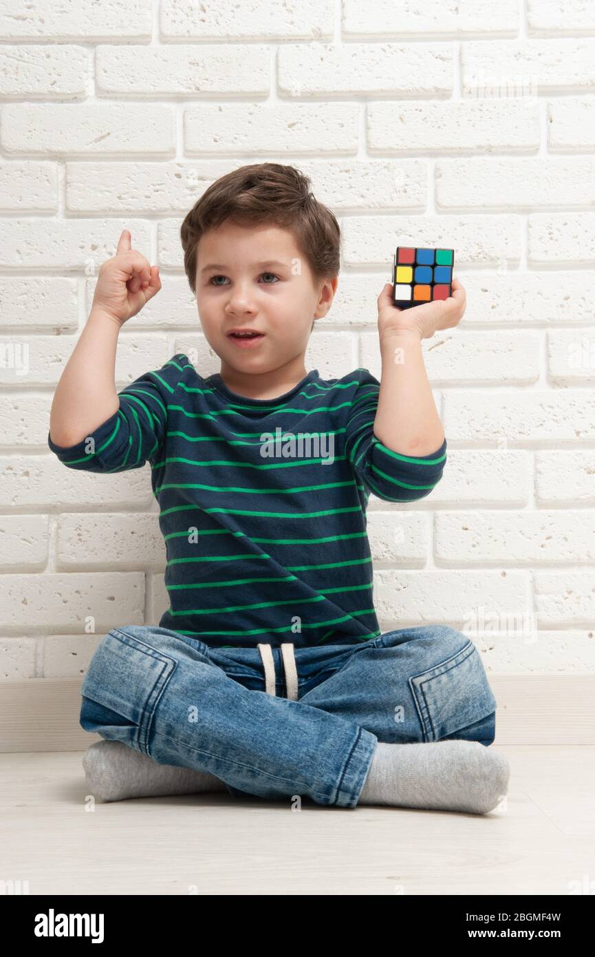 Kiev, Ukraine, 22 march 2020. boy plays with rubik's cube. Rubik's Cube ...