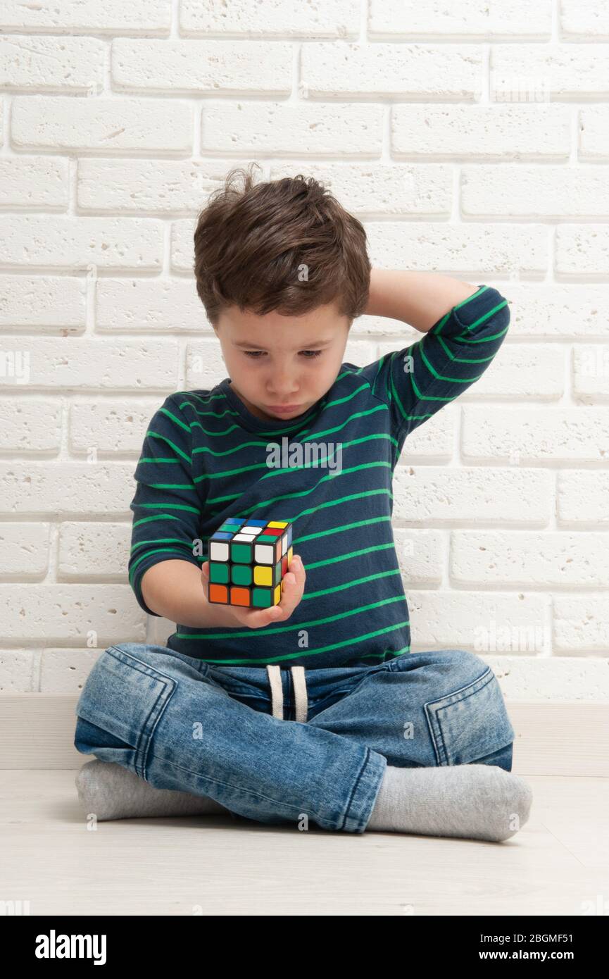 Kiev, Ukraine, 22 march 2020. boy plays with rubik's cube. Rubik's Cube ...