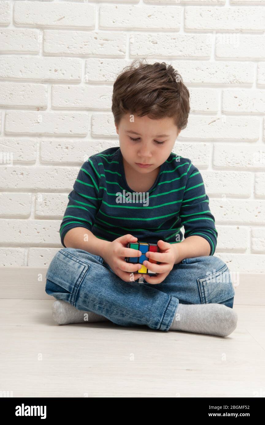 Kiev, Ukraine, 22 march 2020. boy plays with rubik's cube. Rubik's Cube ...