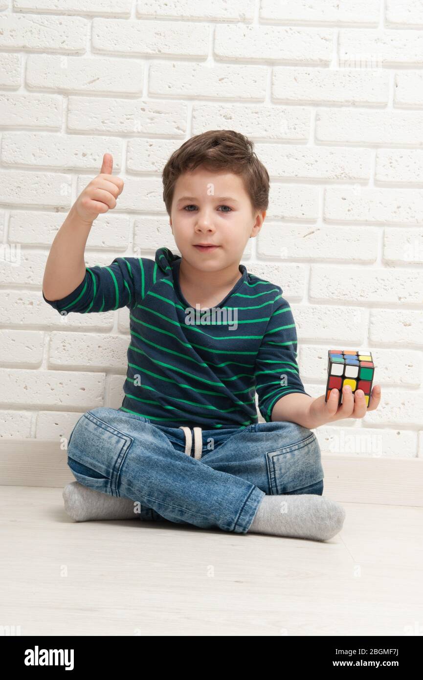 Kiev, Ukraine, 22 march 2020. boy plays with rubik's cube. Rubik's Cube ...
