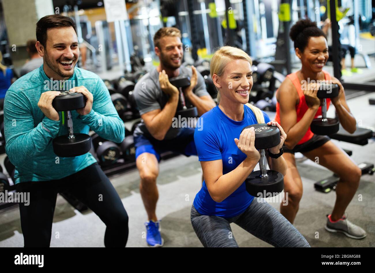 Group of friends smiling and enjoy sport in gym Stock Photo - Alamy