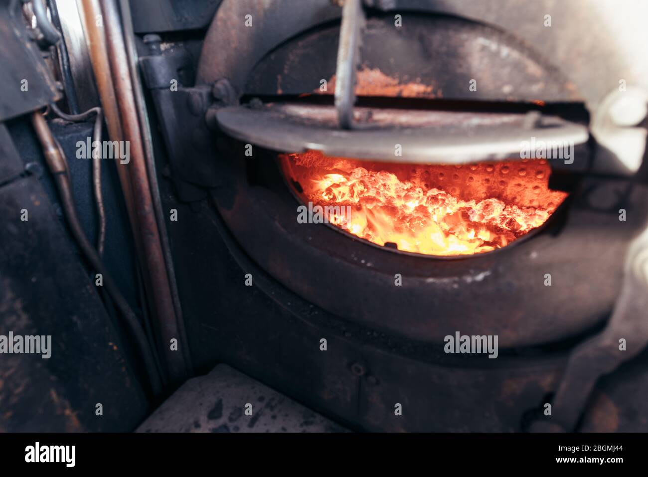Coal burning orange in the cab firebox Working British steam locomotive ...