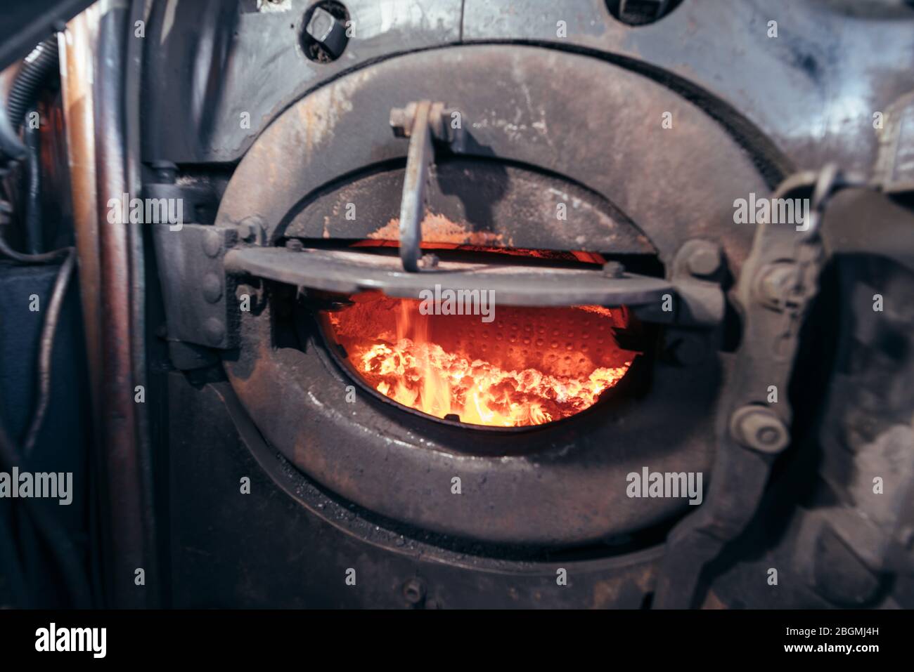 Coal burning orange in the cab firebox Working British steam locomotive ...