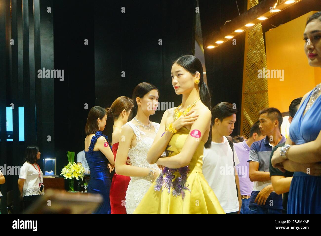 Female models display new gold jewelry Stock Photo - Alamy