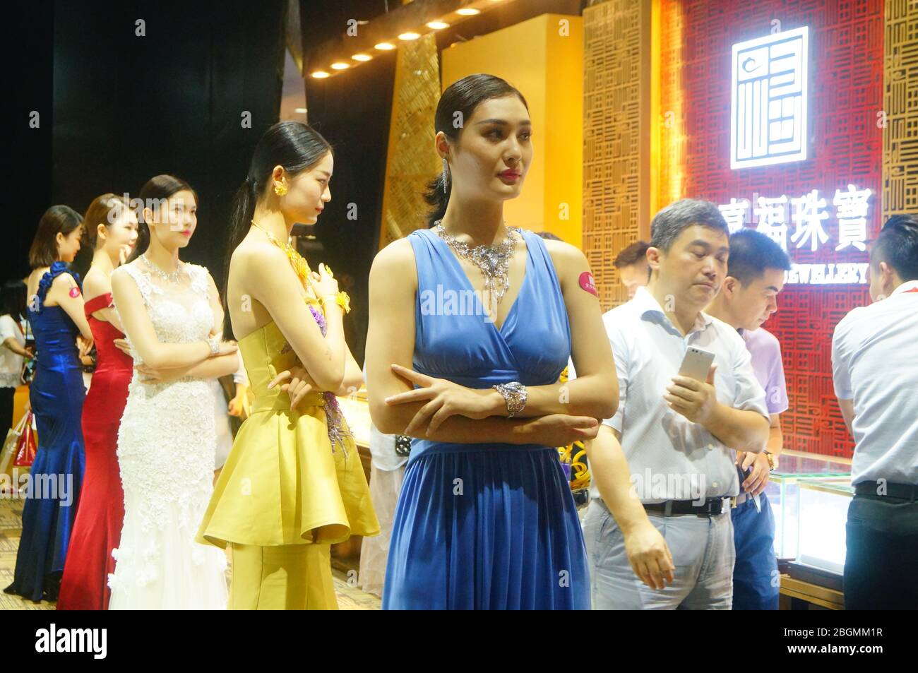 Female models display new gold jewelry Stock Photo - Alamy