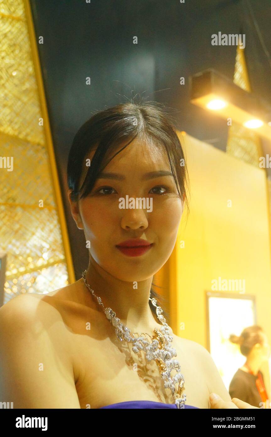 Female models display new gold jewelry Stock Photo - Alamy