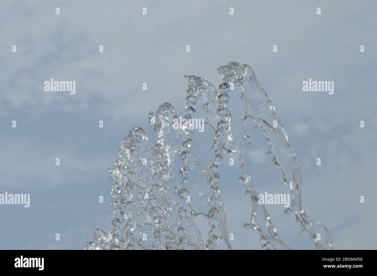 Water gushing from a fountain. Flush with water Stock Photo - Alamy