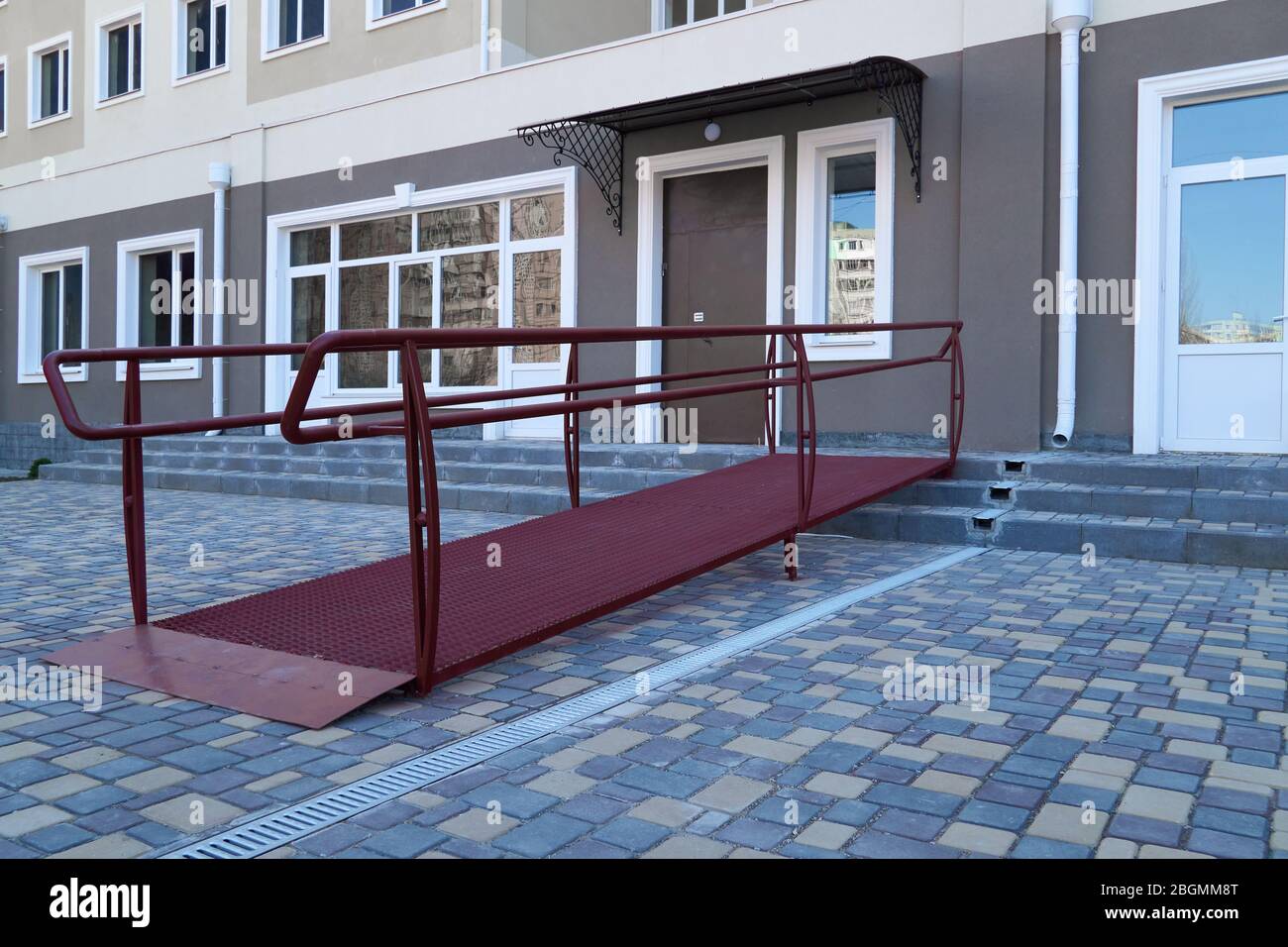 Wheelchair access ramp for entrance of residential multistory building ...