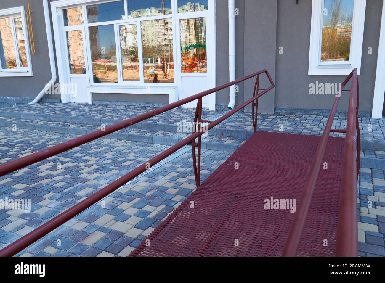 Wheelchair access ramp for entrance of residential multistory building ...