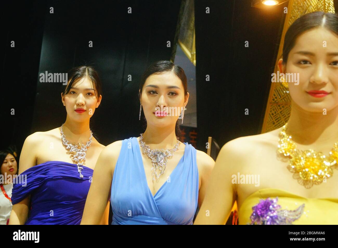 Female models display new gold jewelry Stock Photo - Alamy