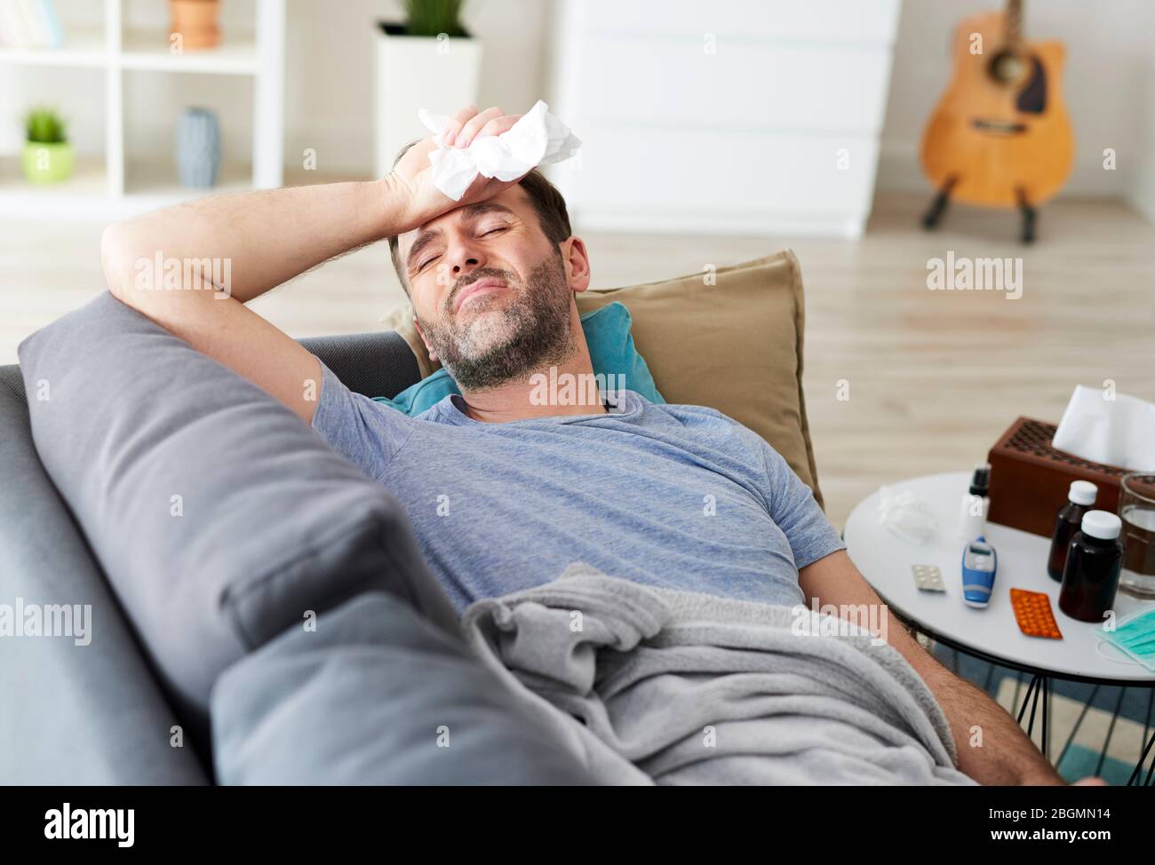Flu symptoms man blanket hi-res stock photography and images - Alamy